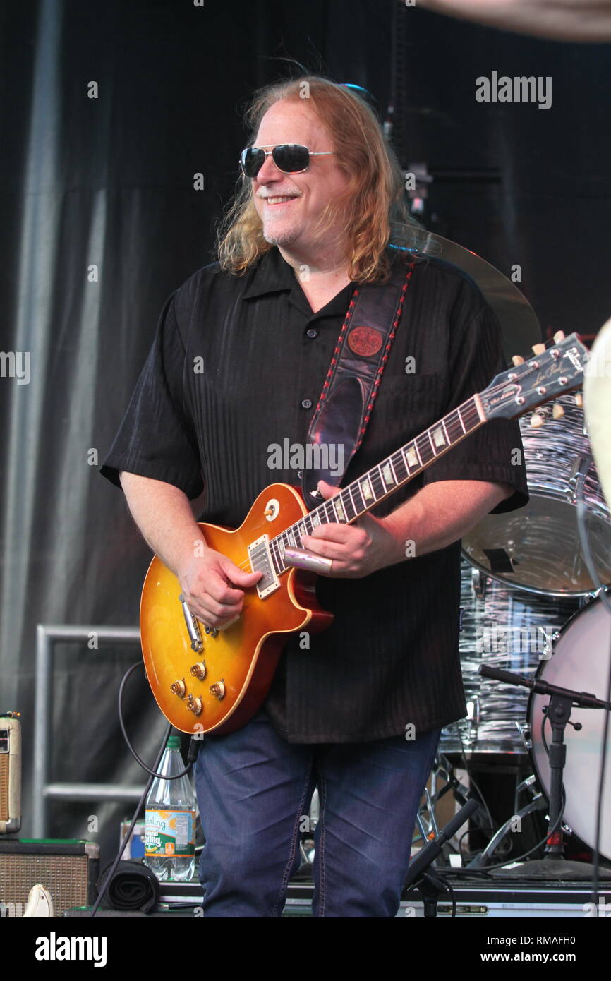 Musician Warren Haynes is shown performing on stage during a "live ...