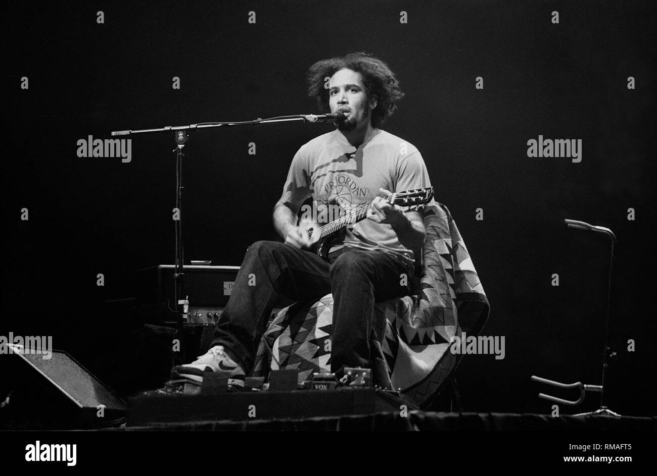 Musician Ben Harper is shown performing on stage during a "live"concert ...