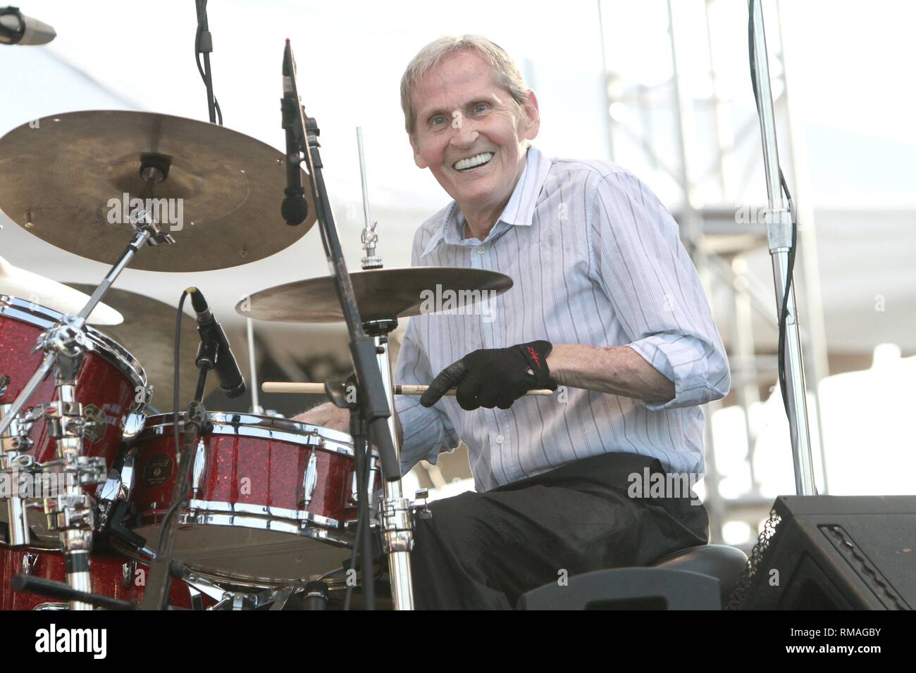 Musician Levon Helm is shown performing on stage during a "live ...