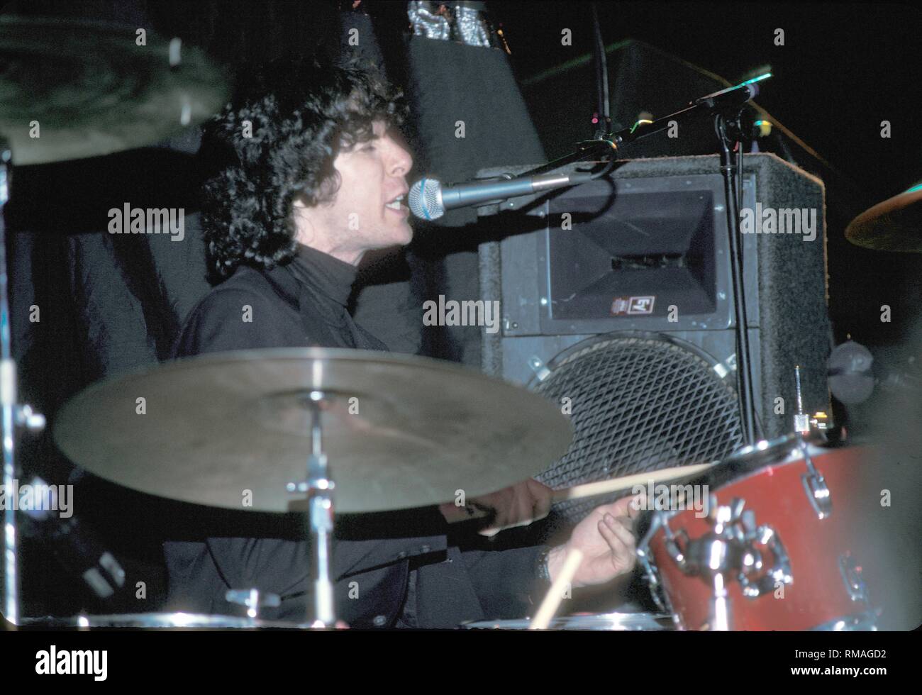 Singer and songwriter Richard X. Heyman is shown playing drums on stage ...