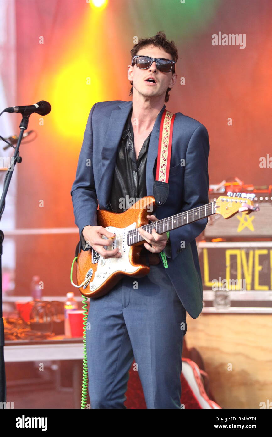 Musician Matt Myers is shown performing on stage during a "live ...