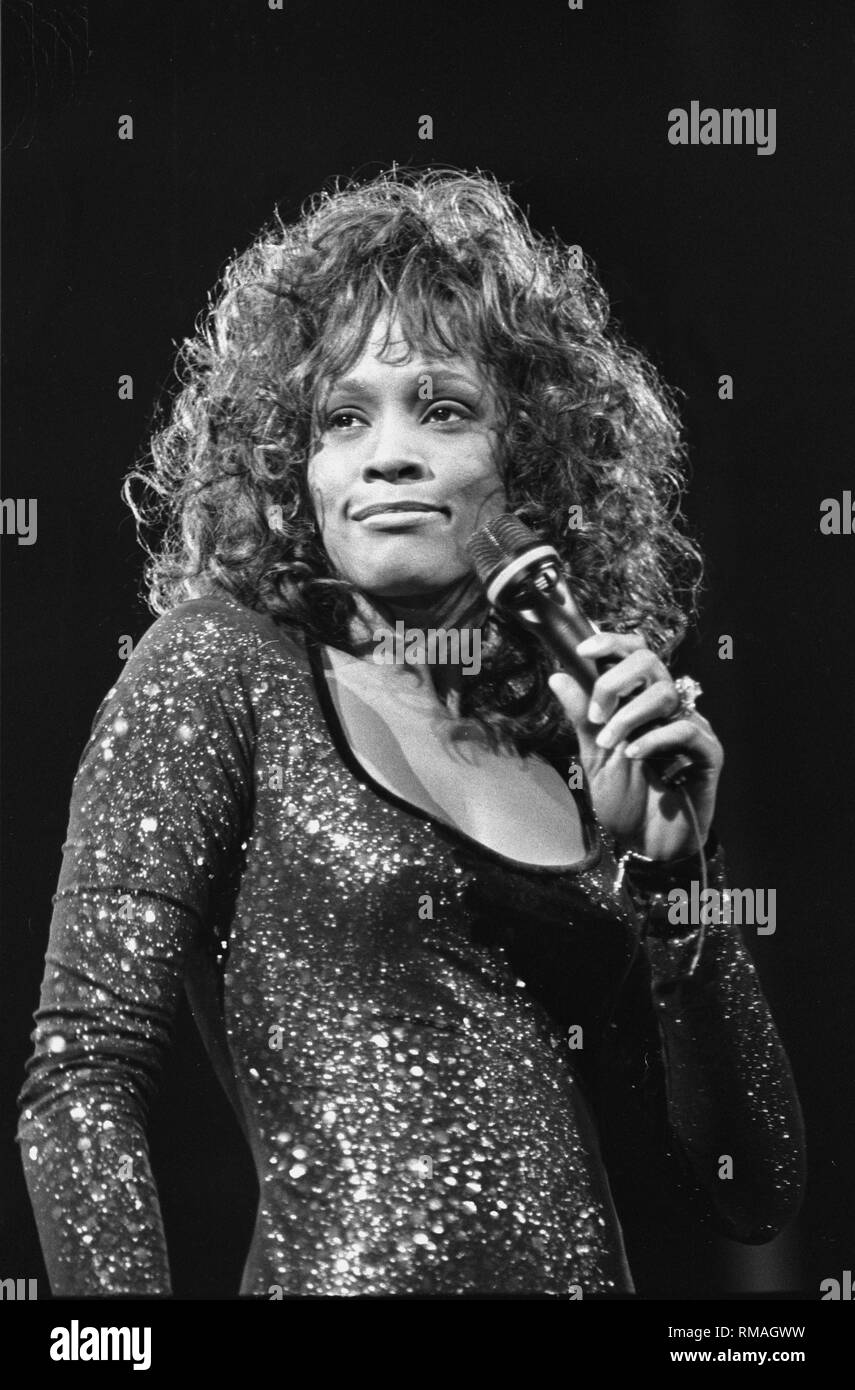 Singer Whitney Houston is shown performing on stage during a "live ...