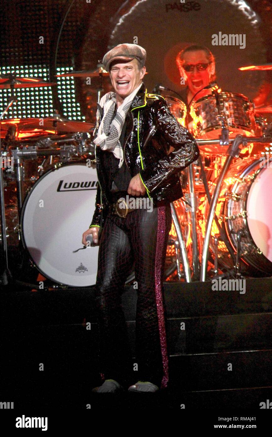 Singer David Lee Roth is shown performing on stage during a "live ...