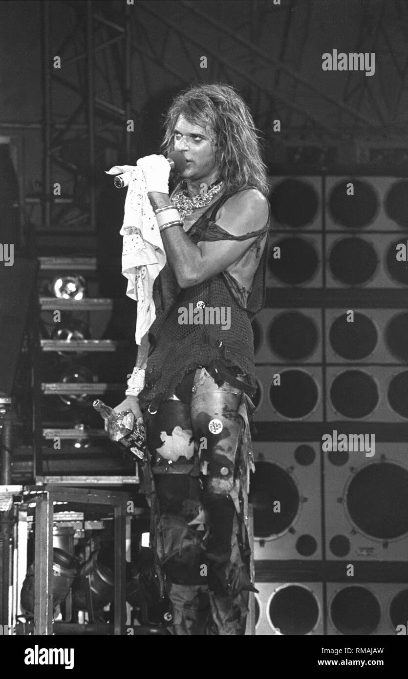 Singer David Lee Roth is shown performing on stage during a "live ...