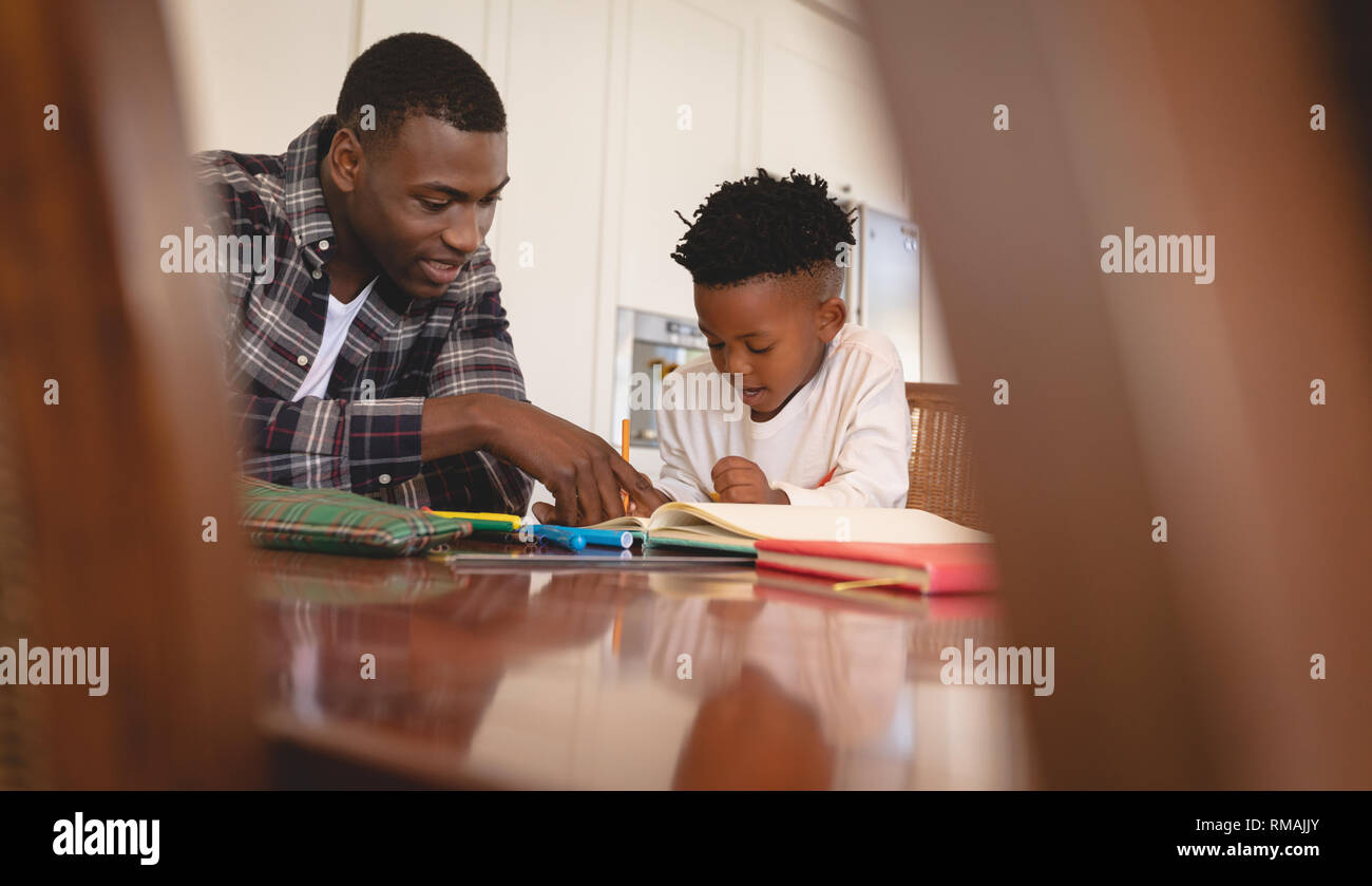 African father child homework hi-res stock photography and images - Alamy