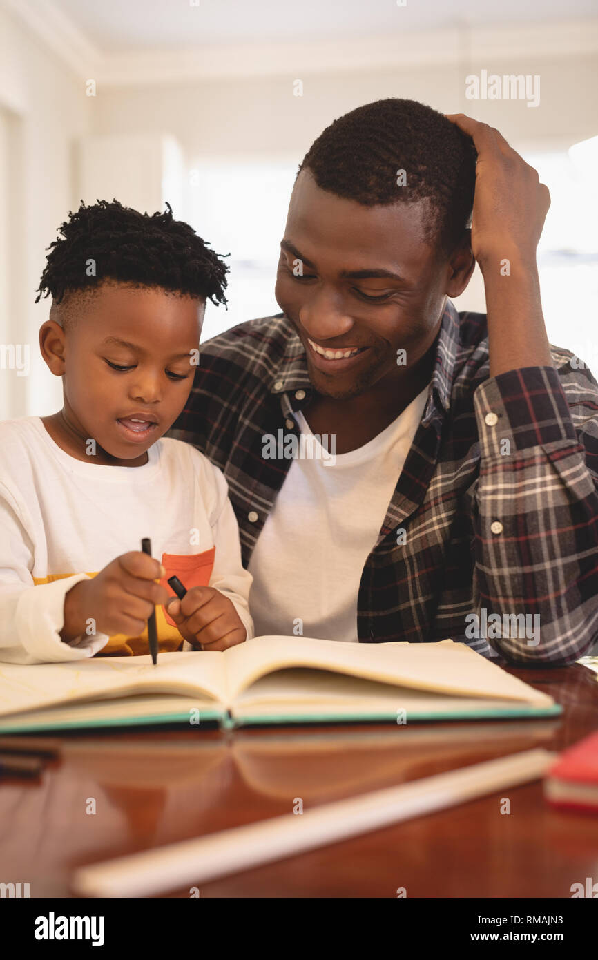 Parent child homework african american hi-res stock photography and ...