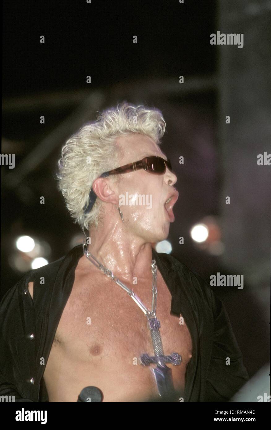 English rock musician Billy Idol is shown performing on stage during ...