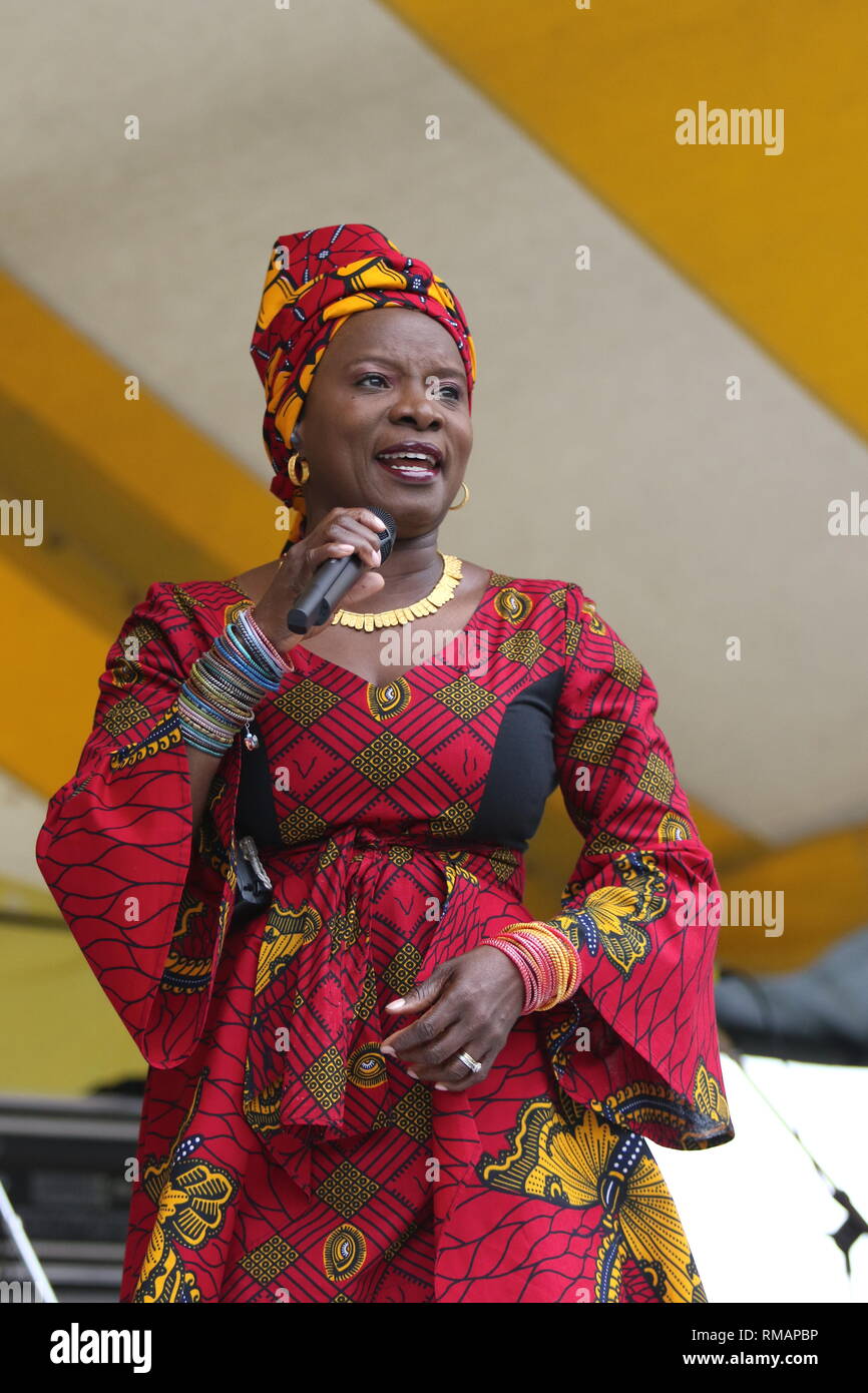 Singer angelique kidjo is shown performing on stage during a hi-res ...