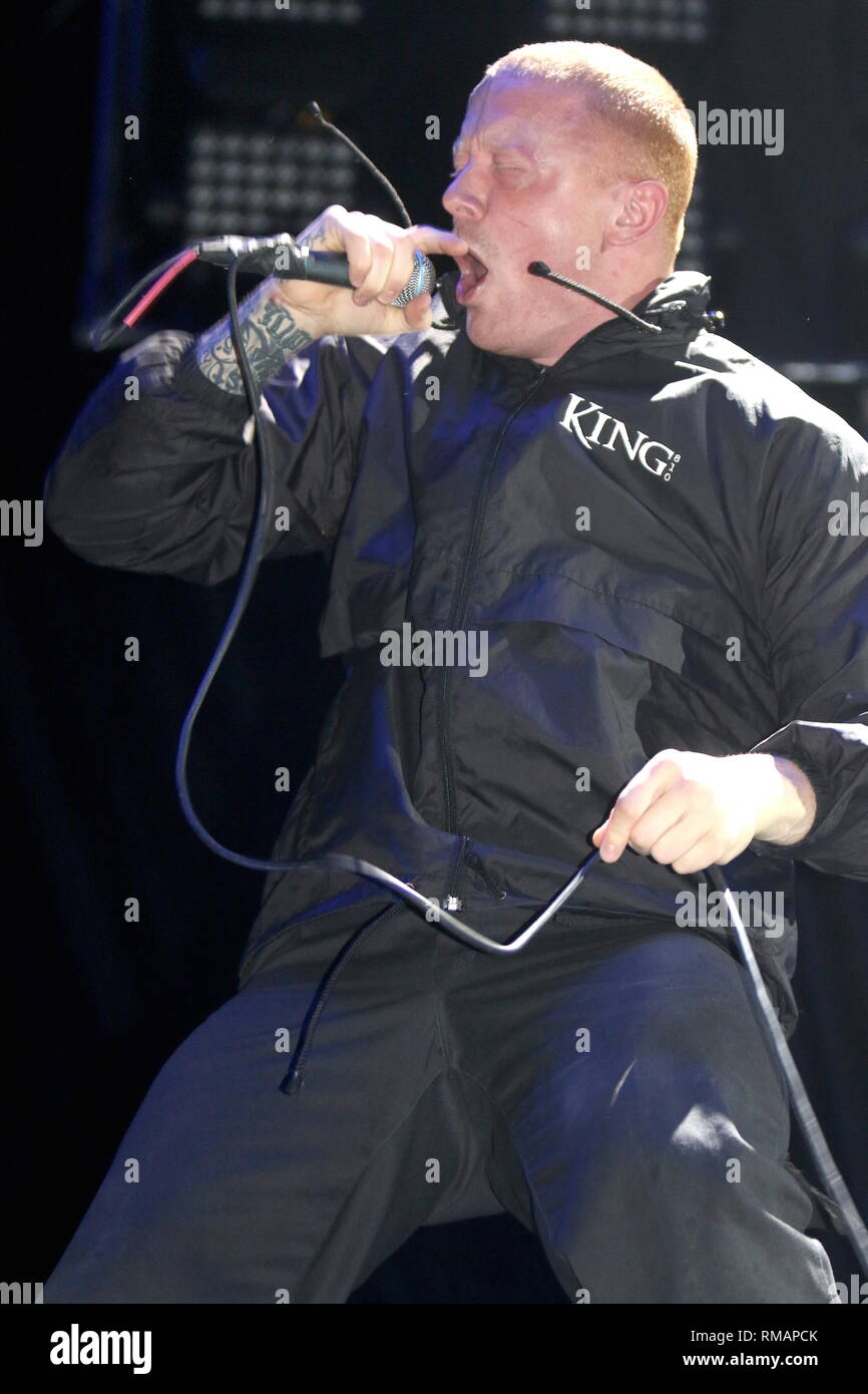 Singer David Gunn is shown performing on stage during a "live" concert ...