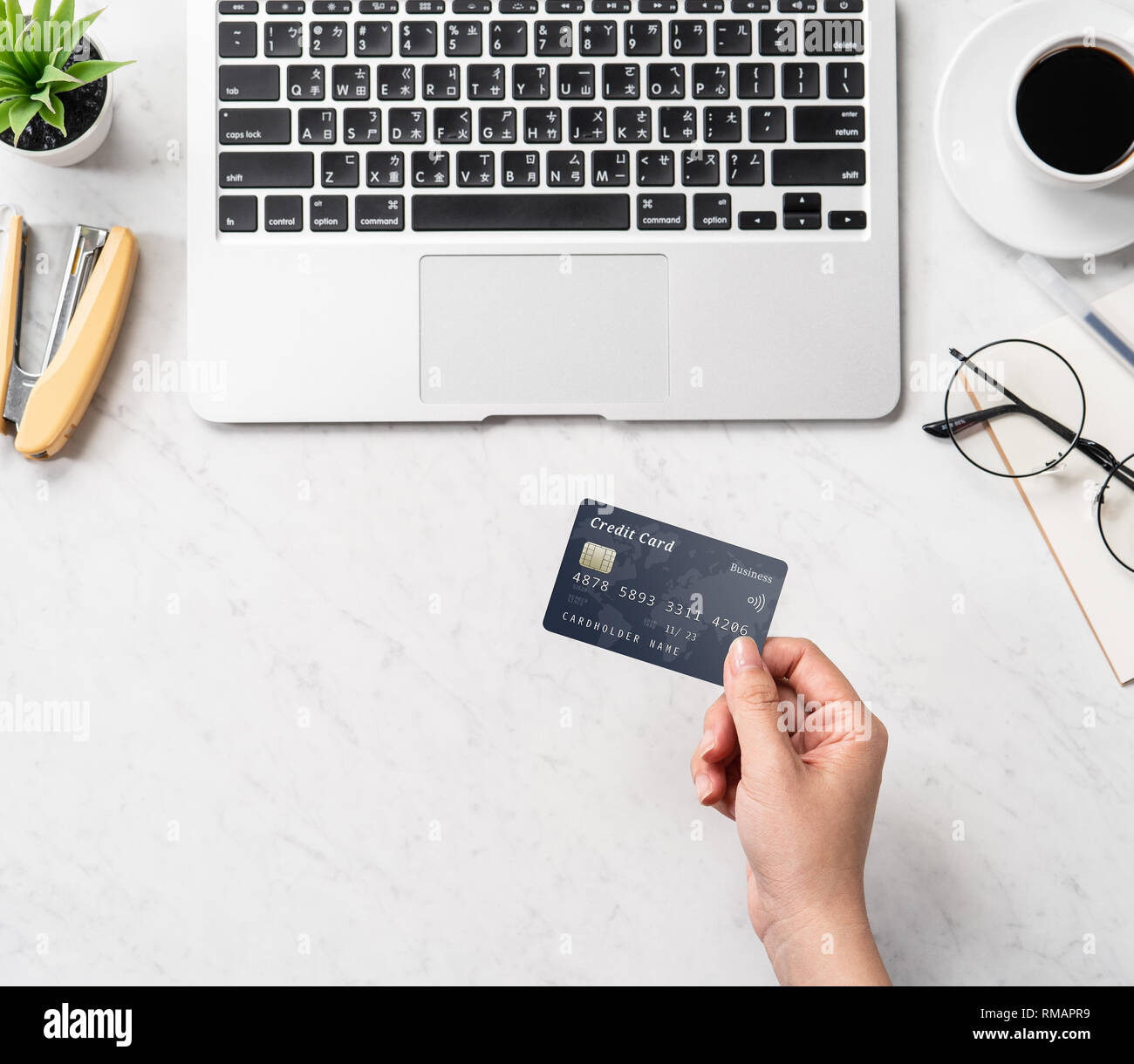Concept of a woman is doing a online purchase, mock up card and ...