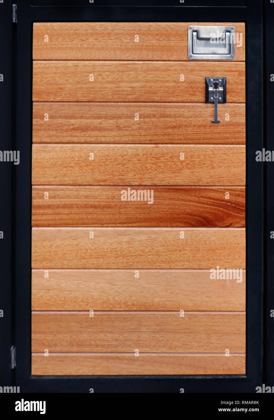 Closed locker inside wall interior with wooden door Stock Photo - Alamy
