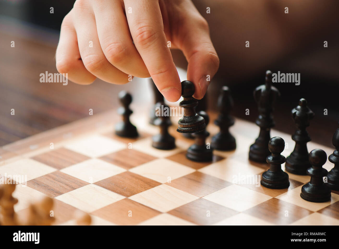 hand moving chess figure in competition success play Stock Photo - Alamy