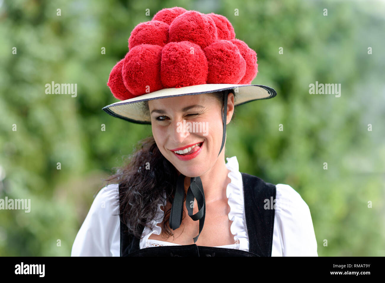 A portrait of a beautiful german woman wearing traditional clothing and ...