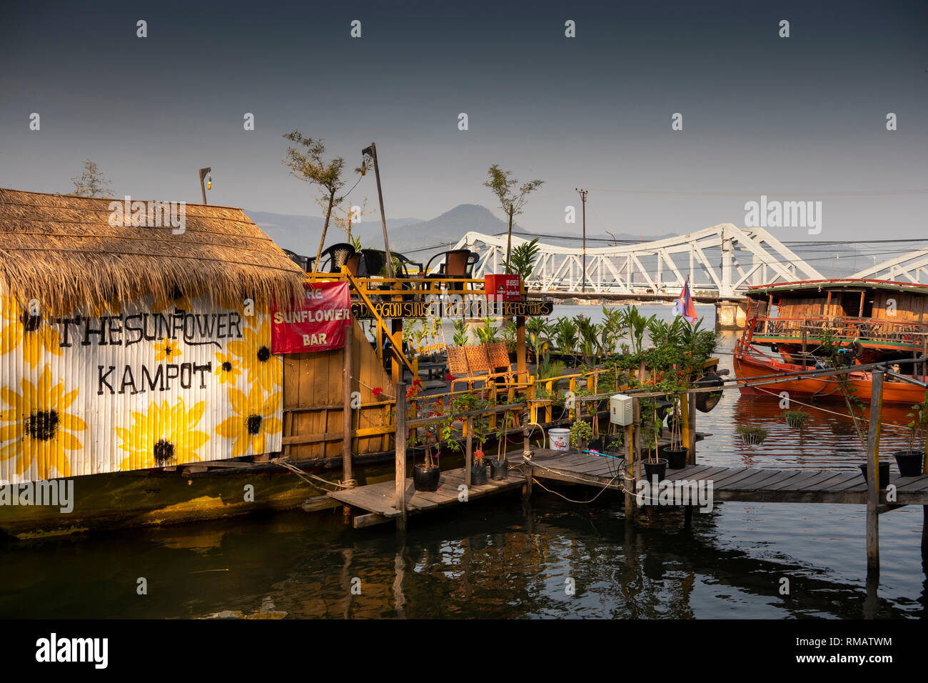 Cambodia, Kampot Province, Kampot, Riverside, Sunflower floating bar ...
