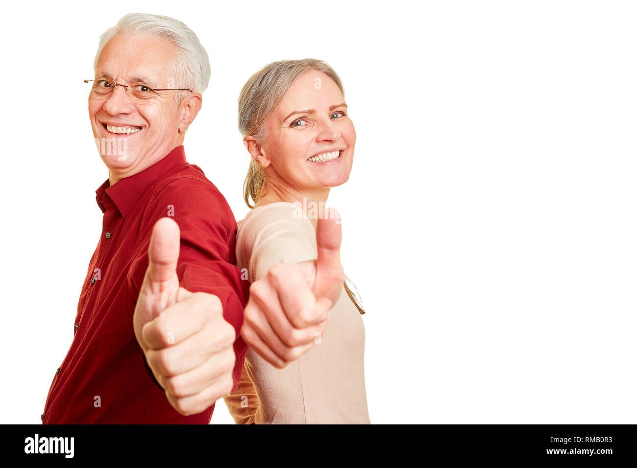 Happy seniors couple keeps thumbs up as a gesture of approval Stock ...