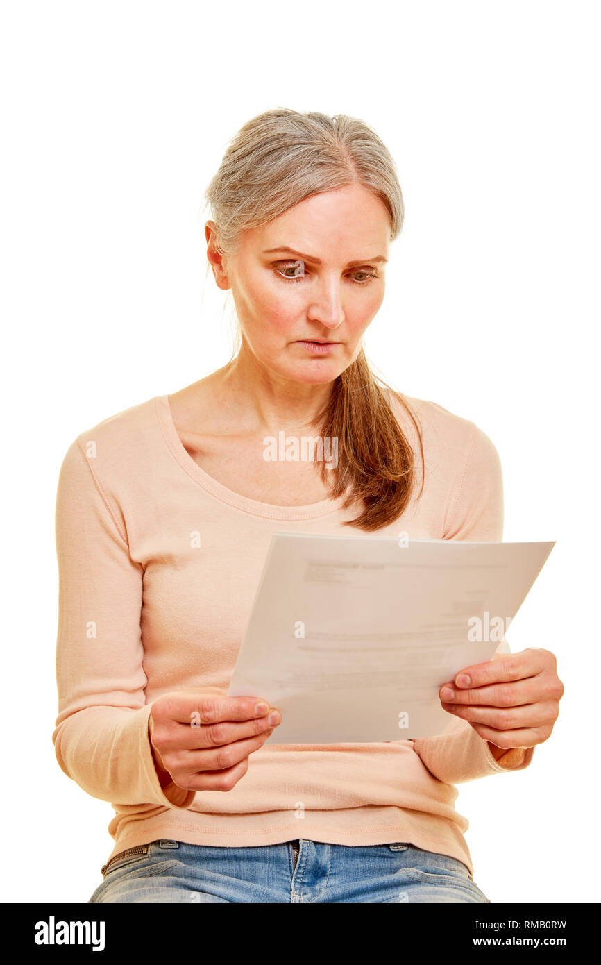 Old woman reads letter with bill or document Stock Photo - Alamy
