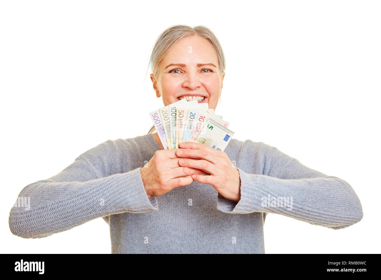 Laughing senior woman as winner of Euro money raffle Stock Photo - Alamy