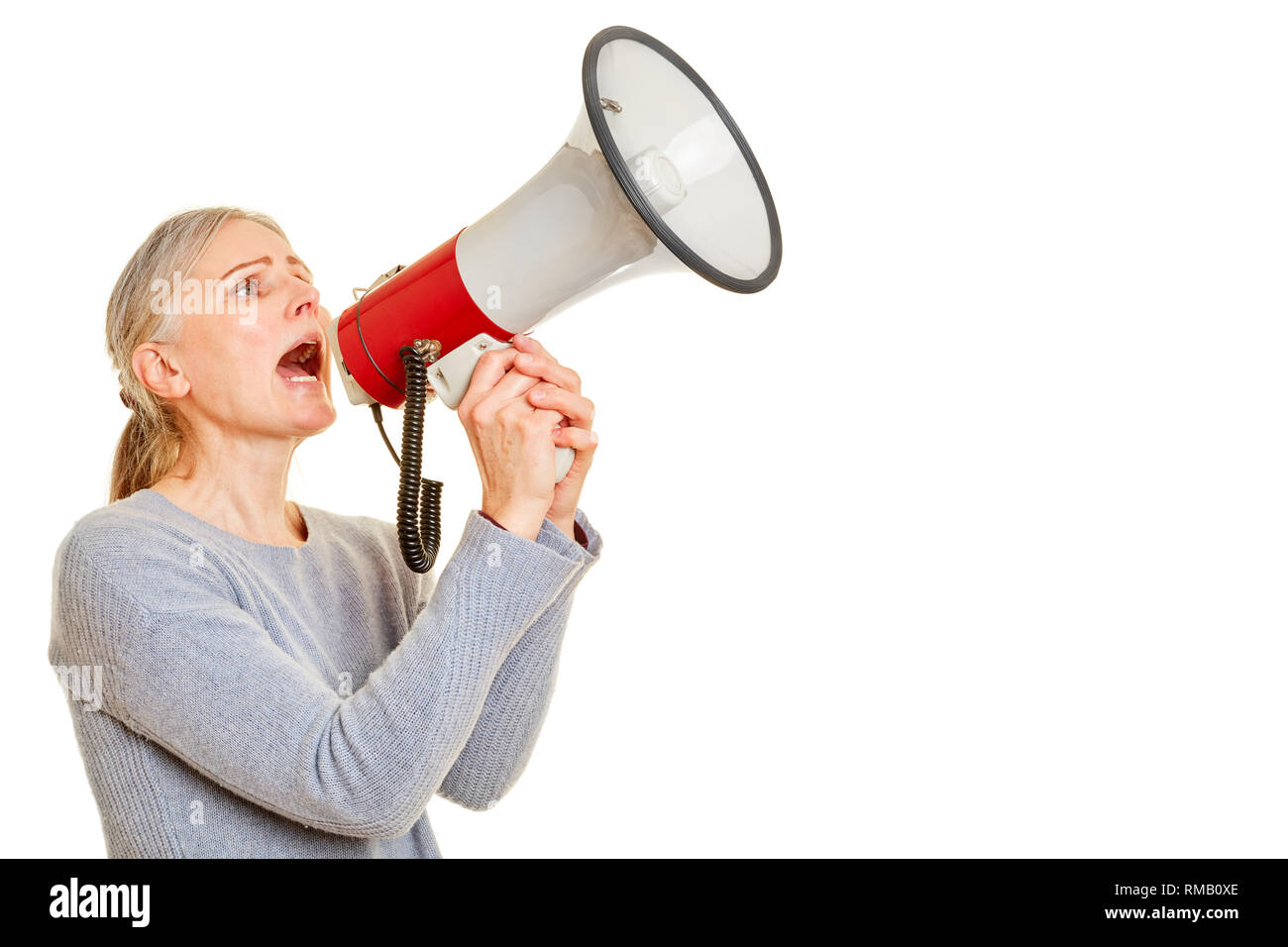Senior uses a loud megaphone for communication Stock Photo - Alamy