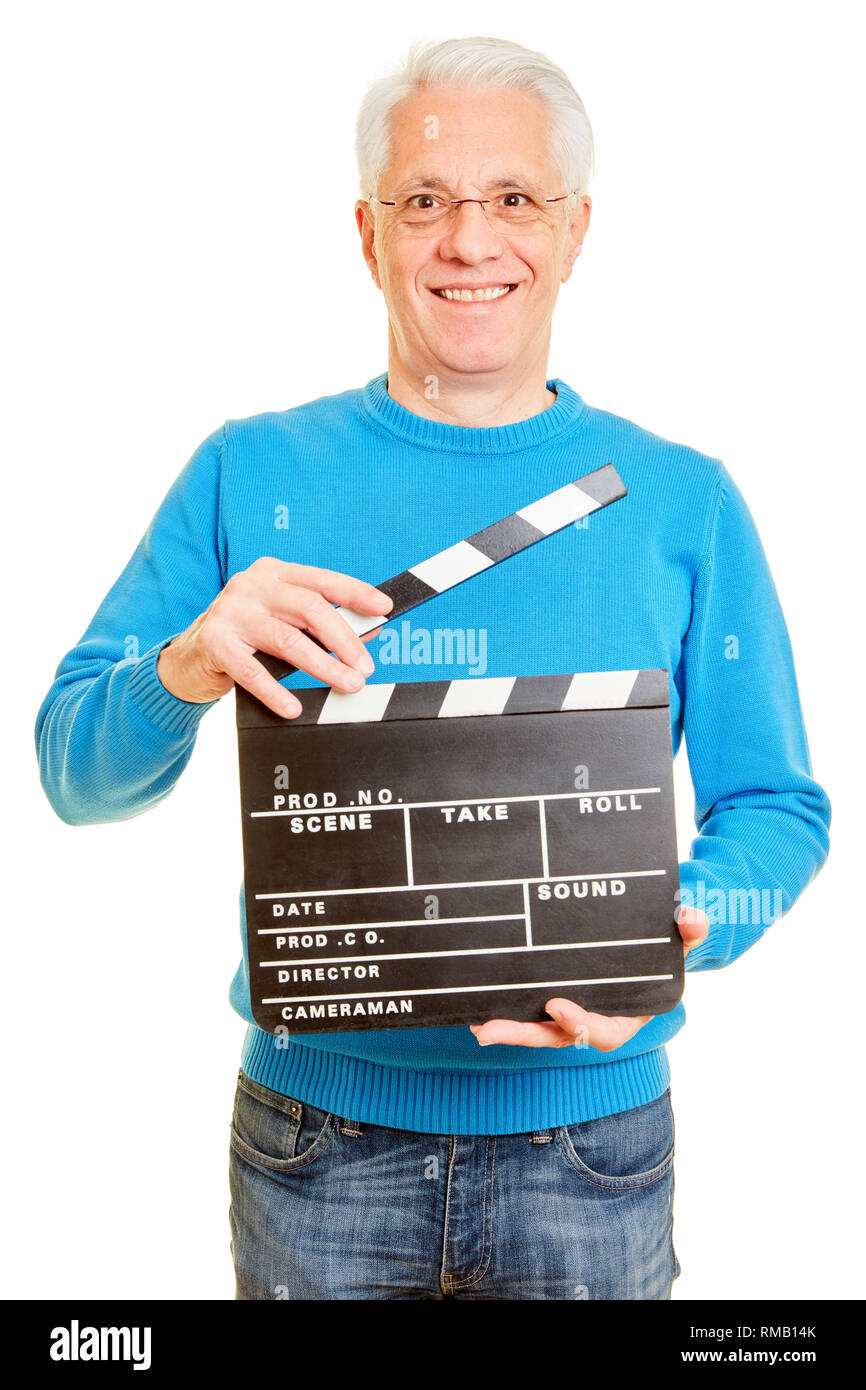 Senior smiling director with movie flap while filming Stock Photo - Alamy