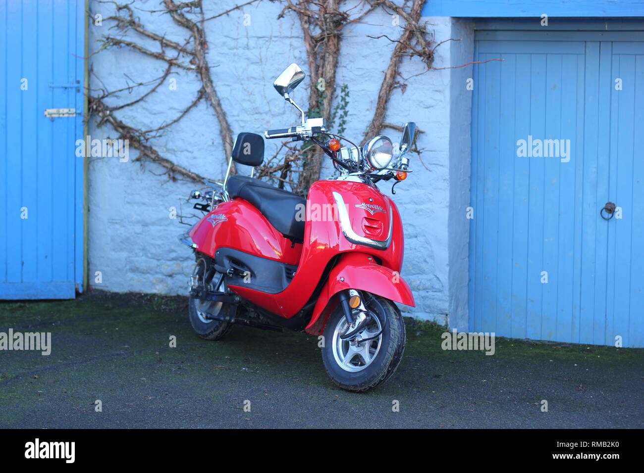 Red mopeds High Resolution Stock Photography and Images - Alamy
