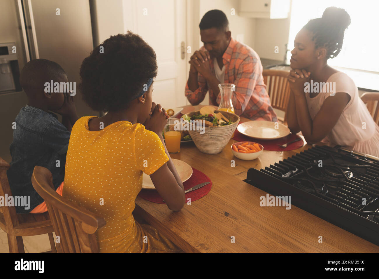 African American family praying together at home Stock Photo - Alamy