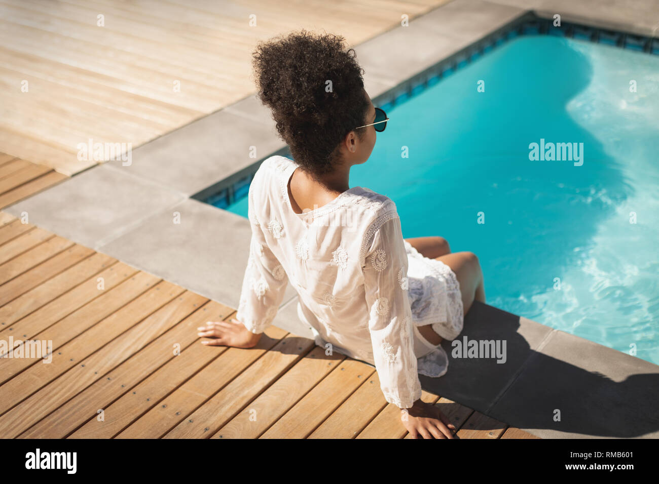 Rear view young woman swimming pool hi-res stock photography and images ...