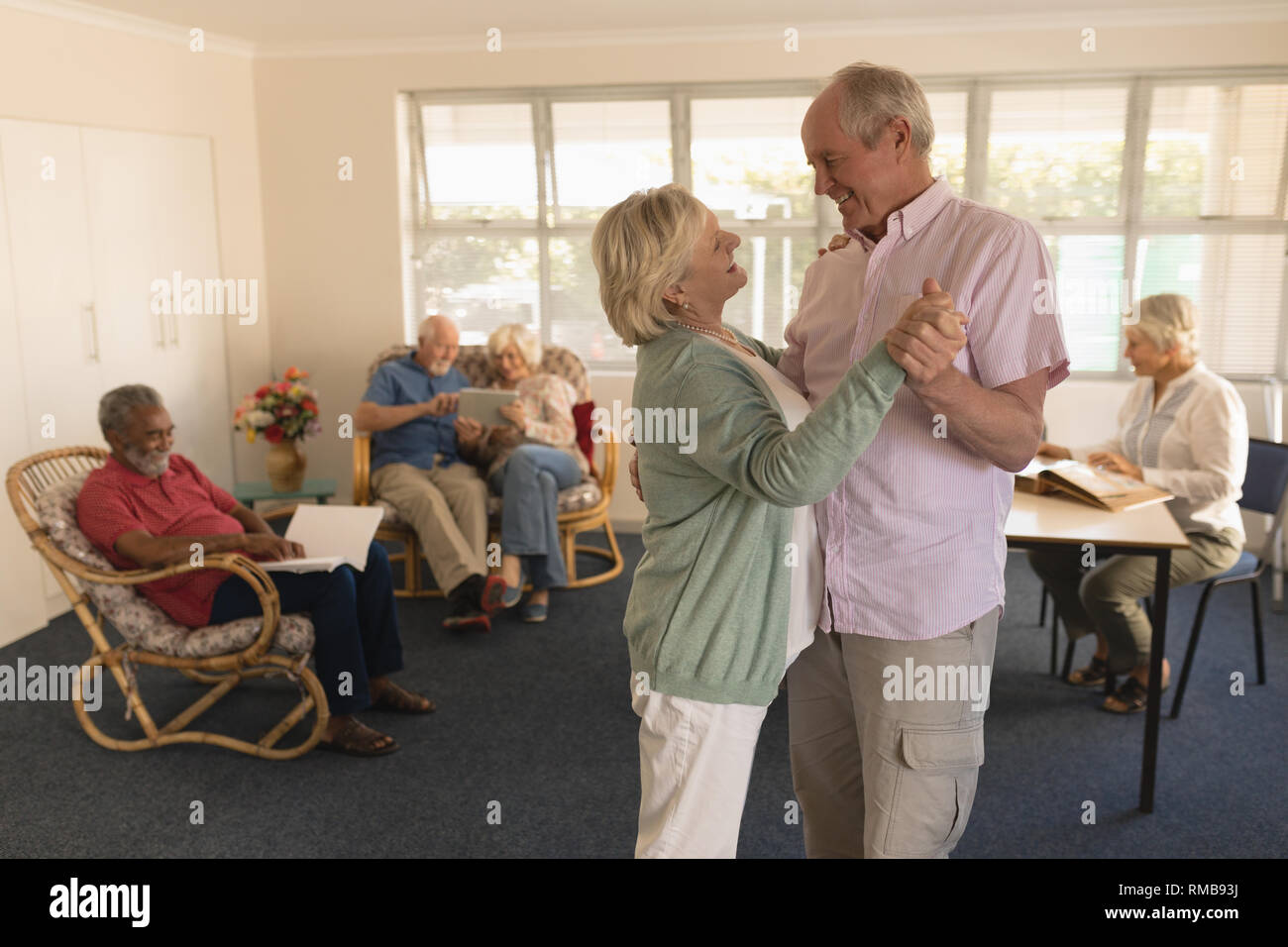 Active Senior Couple Dancing At Nursing Home Stock Photo Alamy
