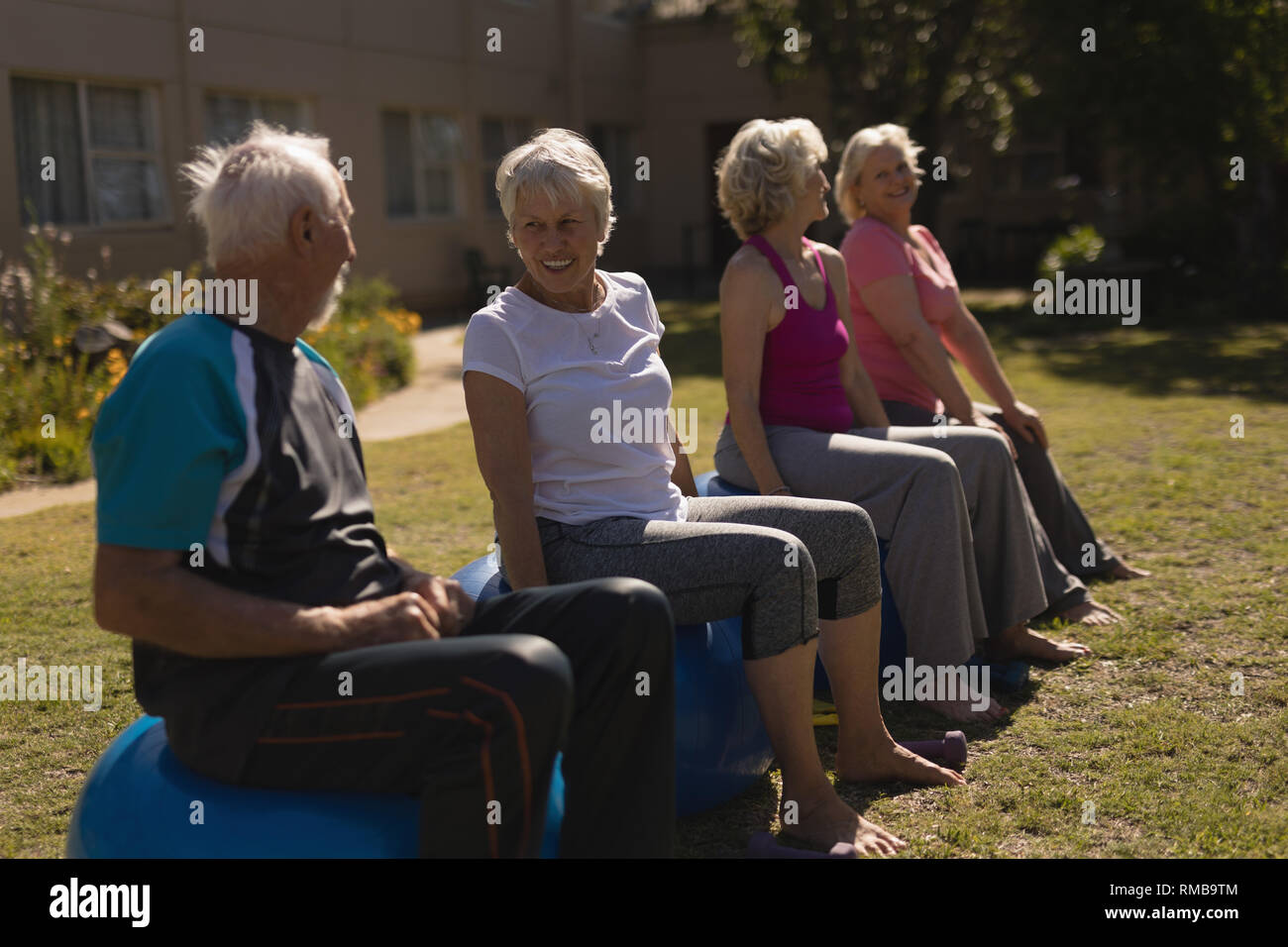 Senior people interacting with each other in the park Stock Photo - Alamy