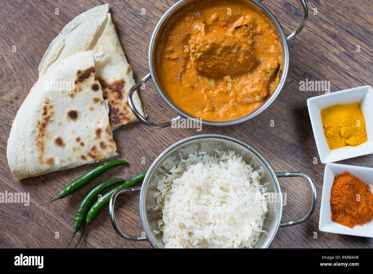 Popular Indian dish of Chicken tikka masala with boiled rice and naan ...
