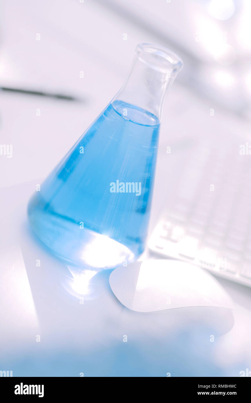close up.a flask of blue liquid in a science lab Stock Photo - Alamy