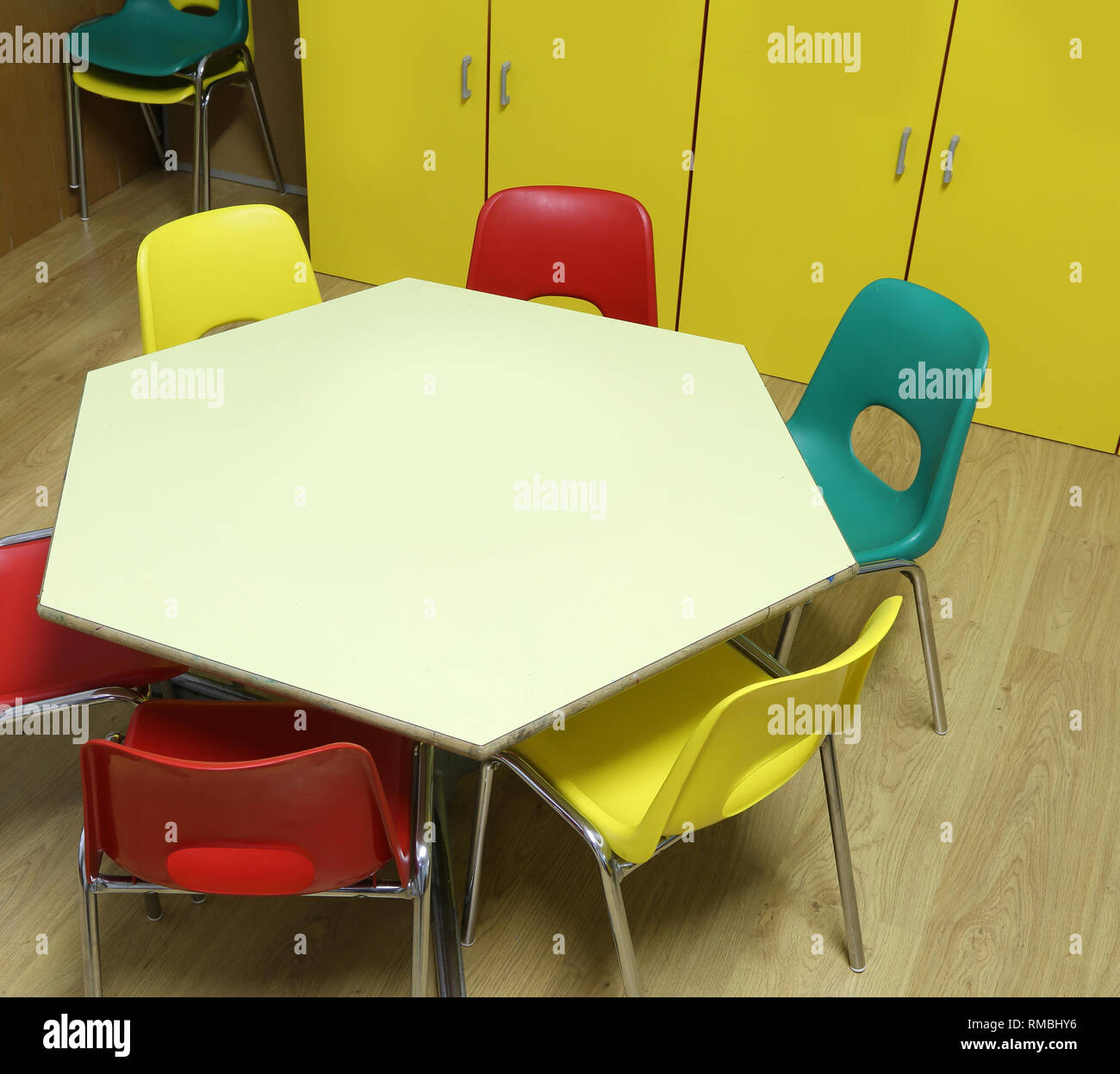 low chairs and hexagonal table of a kindergarten class without kids ...
