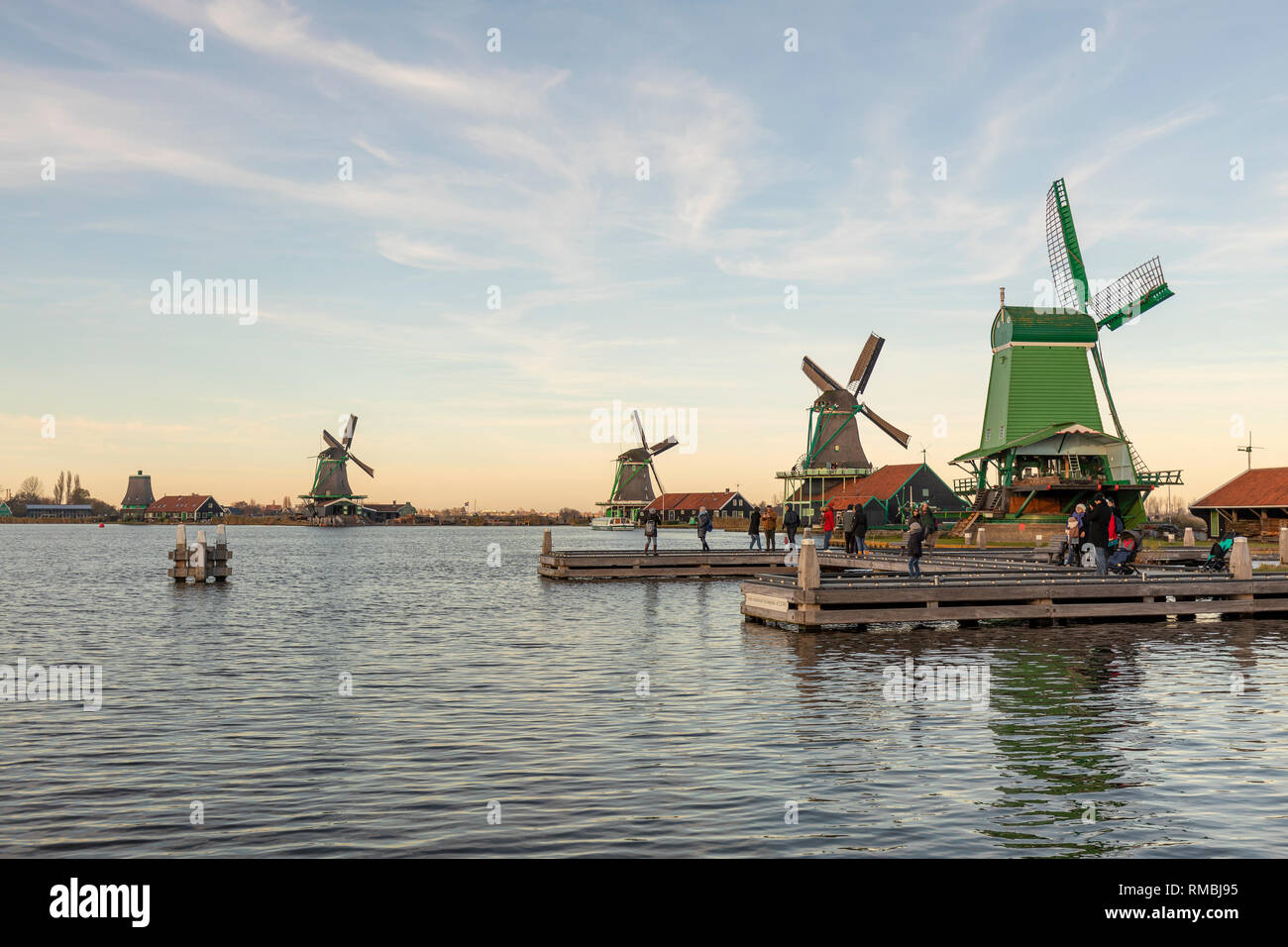 Picturesque typical autumn Dutch windmill landscape with a row of a ...