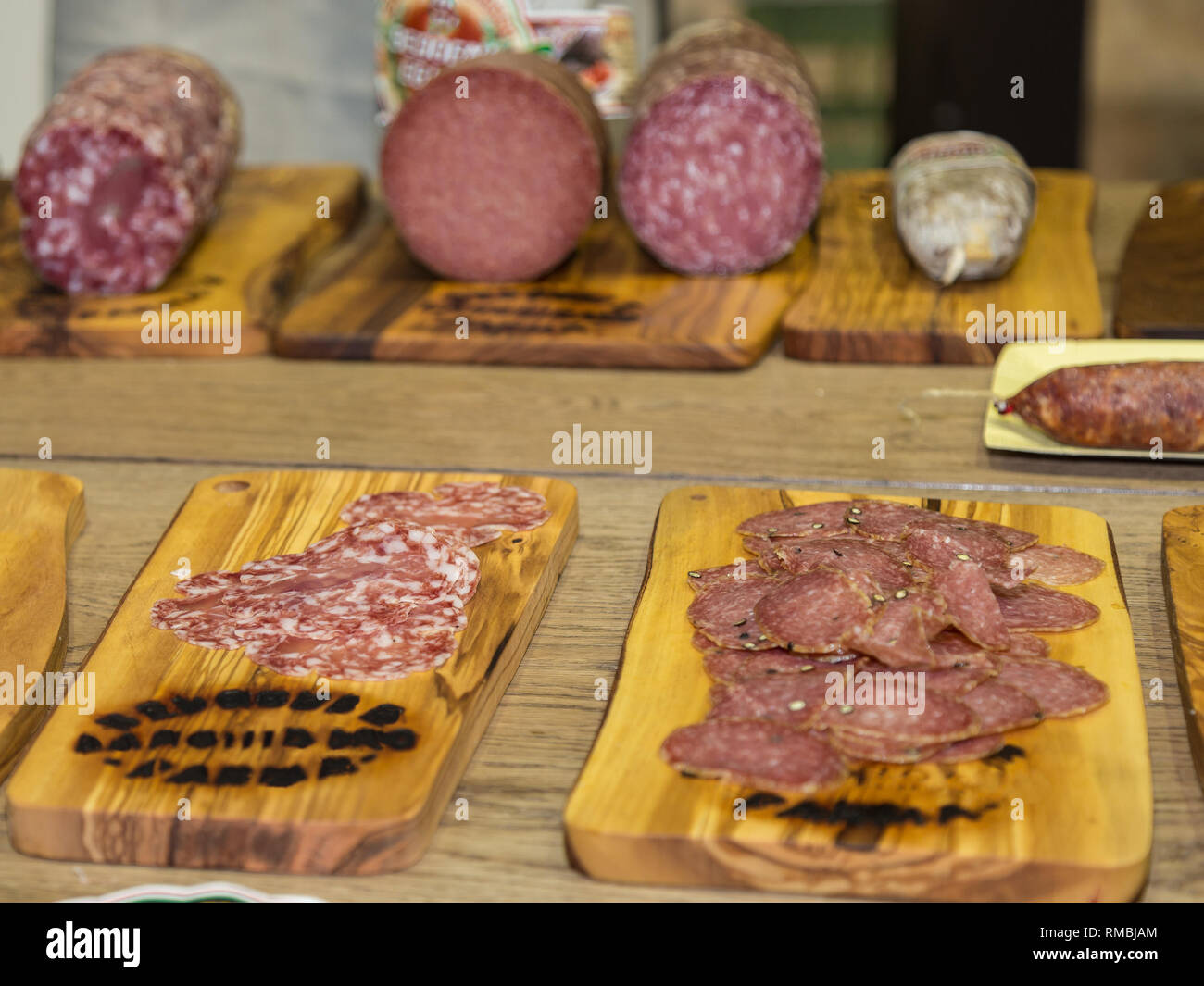 Various Types of Italian Sliced Salami on Wooden Chopping Boards Stock ...