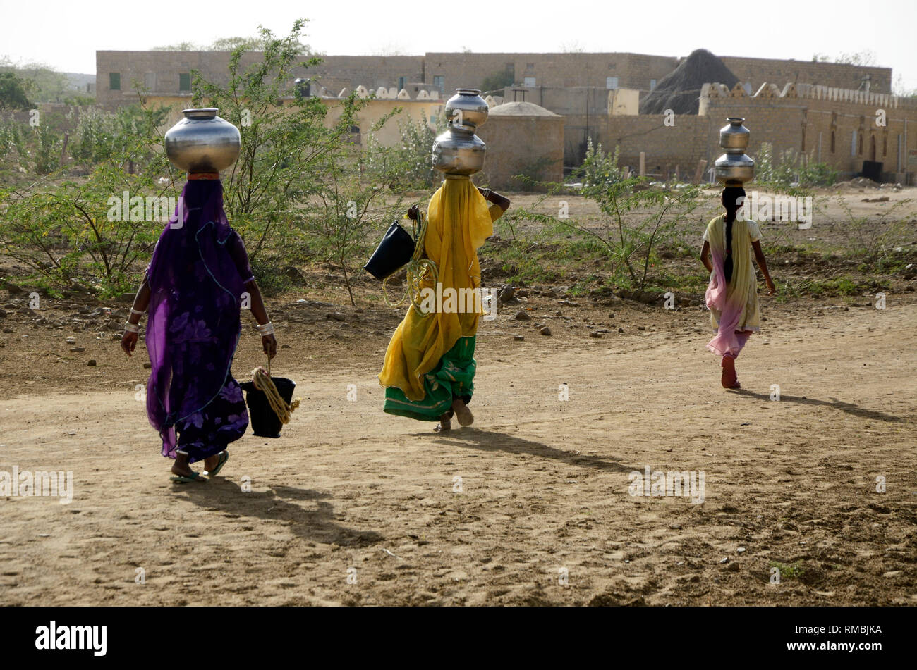 women balancing water pots on head, Jaisalmer, Rajasthan, India, Asia ...