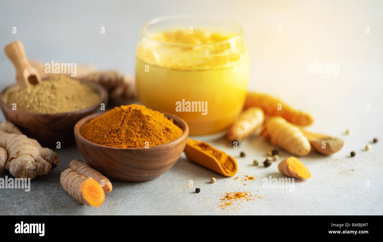 Hot healthy drink. Turmeric latte, golden milk with turmeric root ...