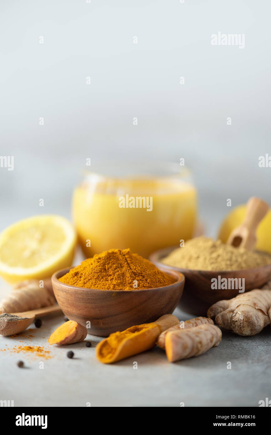 Yellow turmeric latte drink. Golden milk with cinnamon, turmeric ...