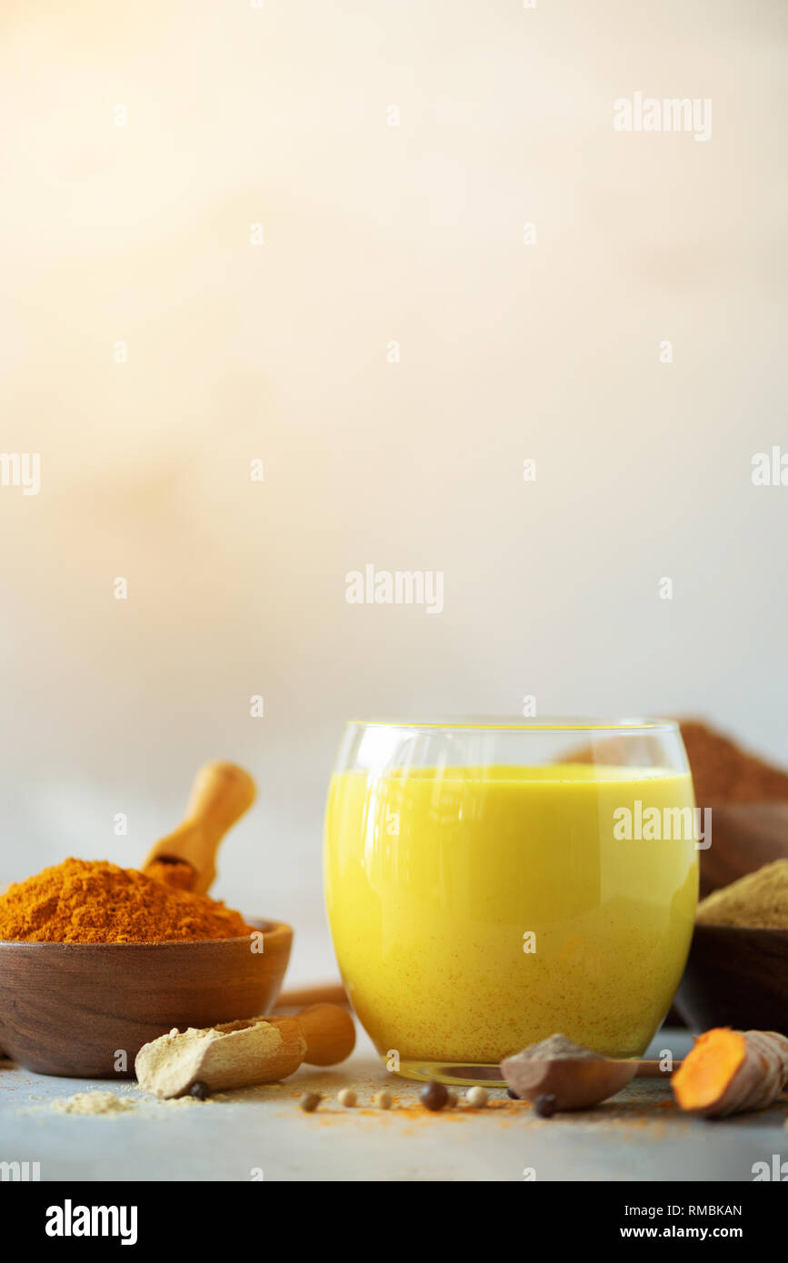 Hot healthy drink. Turmeric latte, golden milk with turmeric root ...