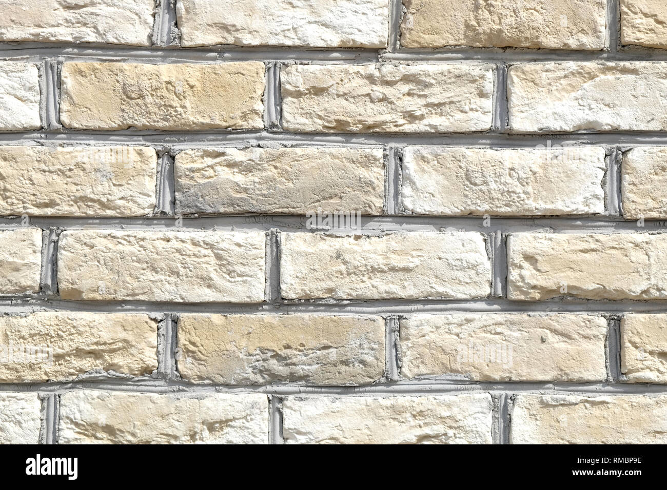 Wall from beige bricks front view closeup horizontal photo Stock Photo ...