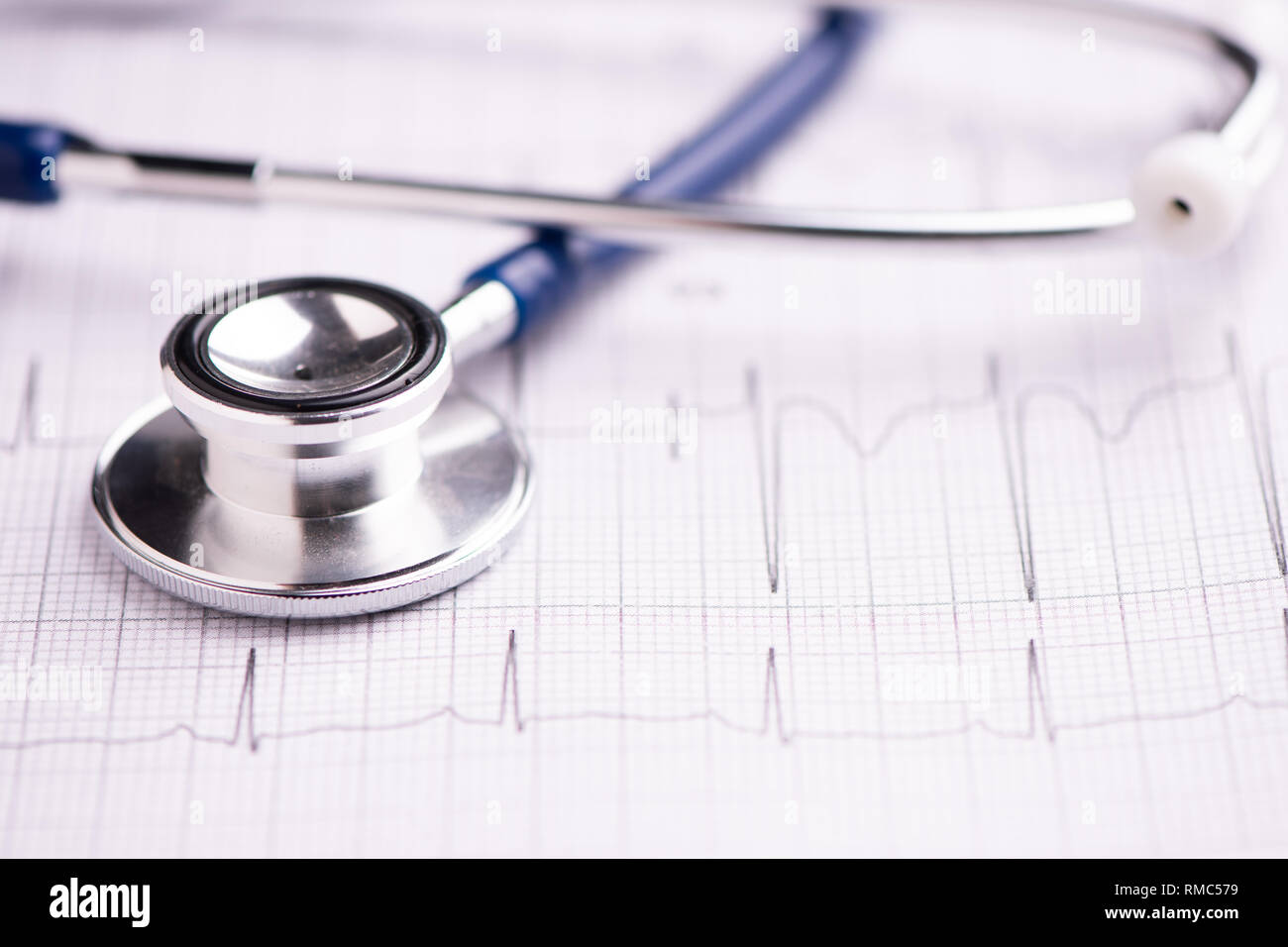 A stethoscope on ecg medical report close up Stock Photo - Alamy