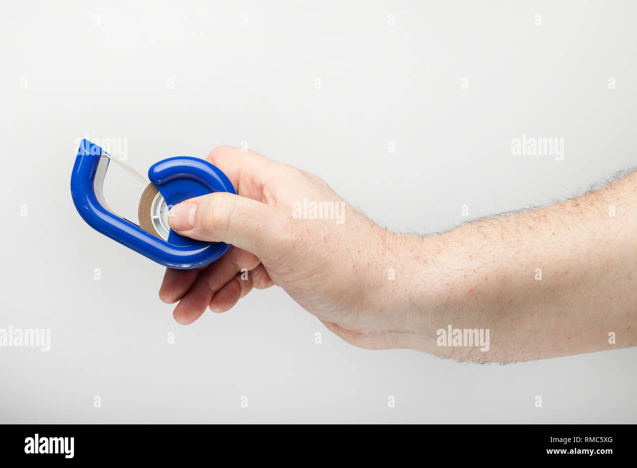 Scotch tape hand hi-res stock photography and images - Alamy