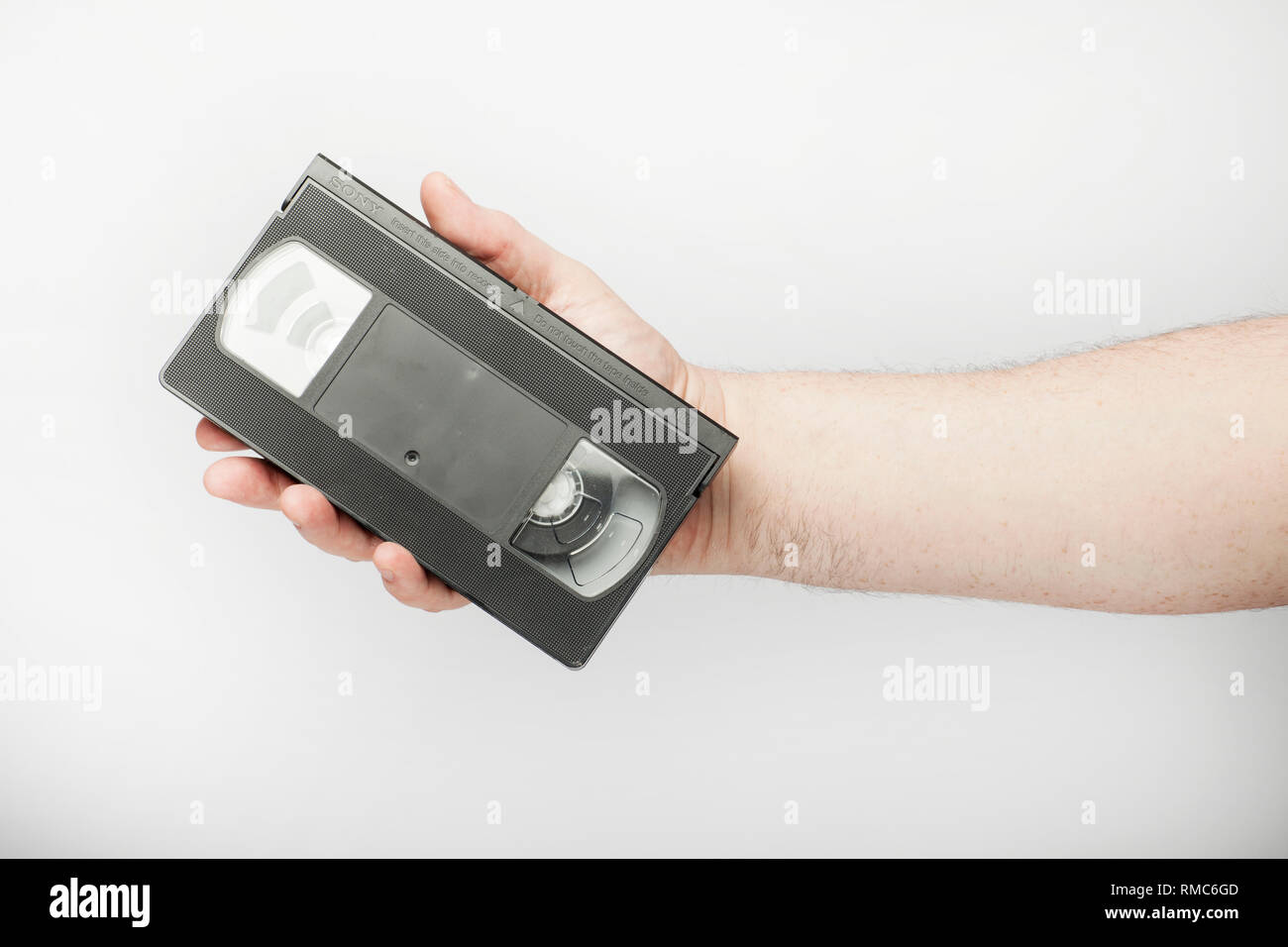 Male hand holds VHS, video tape, isolated on the white background Stock ...