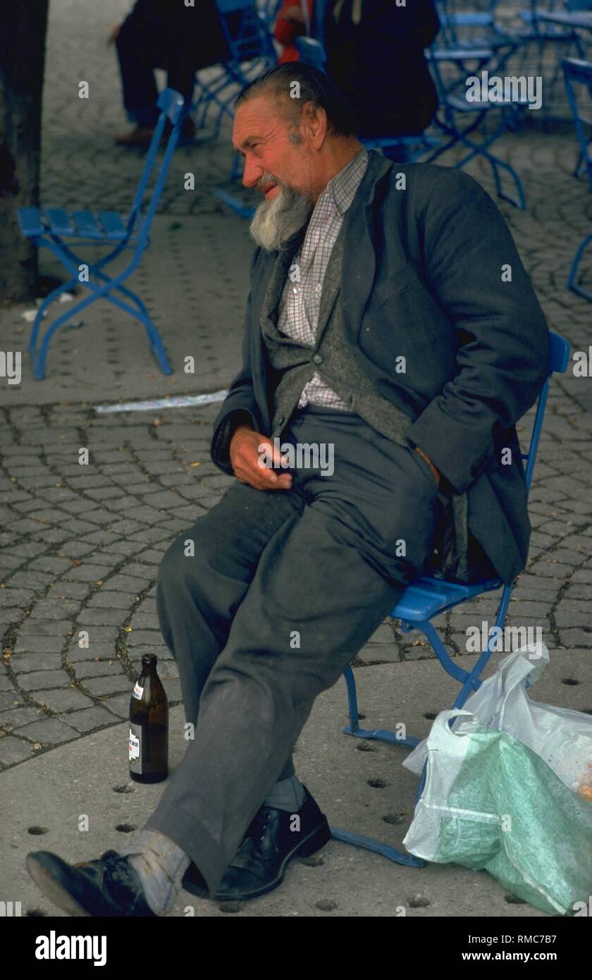Homeless person at the Viktualienmarkt in Munich Stock Photo - Alamy