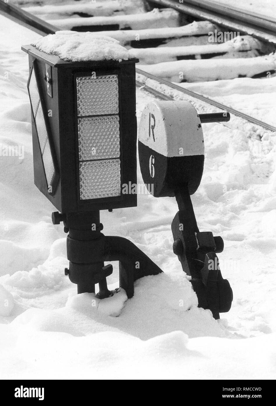 Railroad switch (switch lantern) and counterweight on a railway line ...