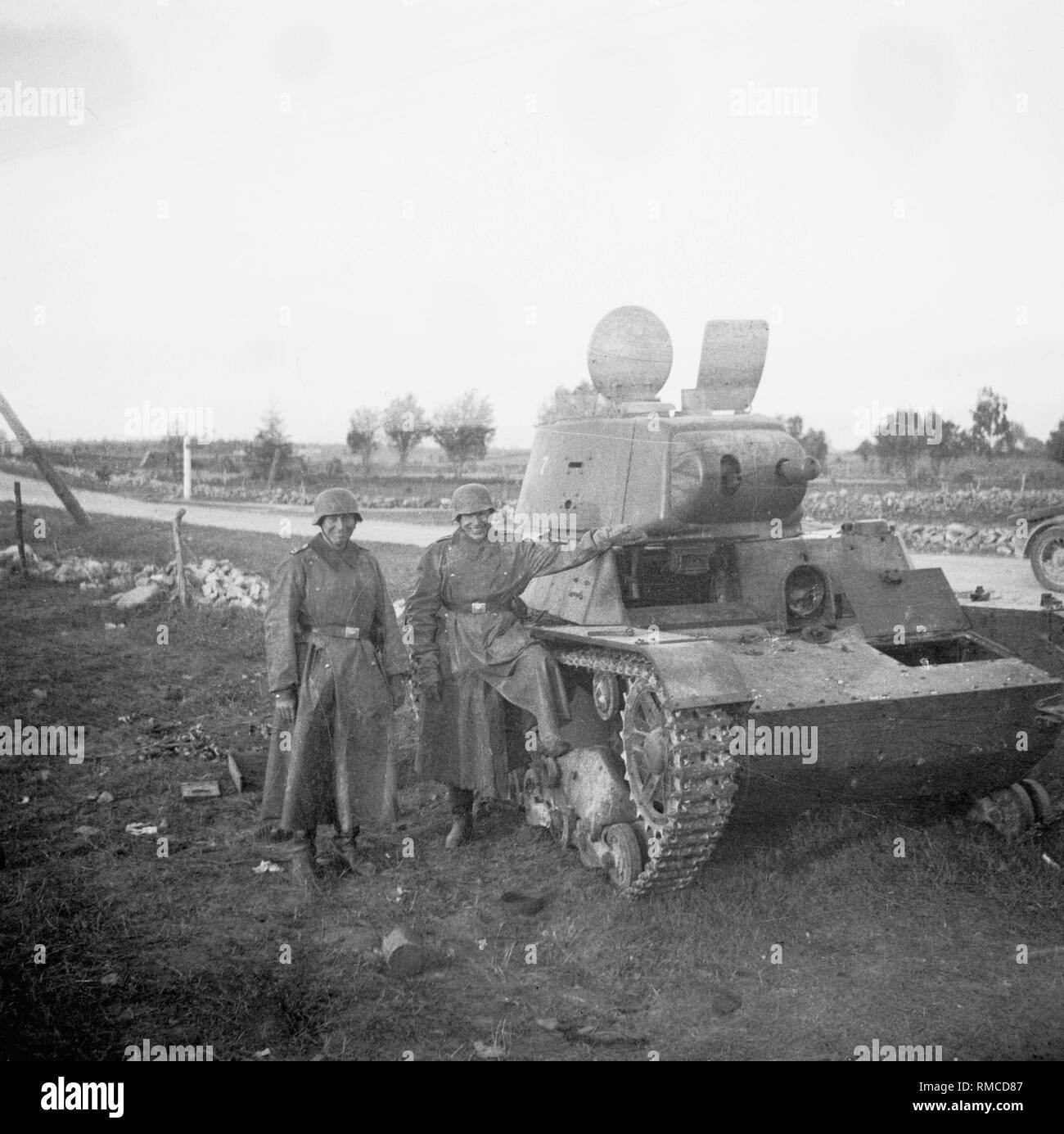 Soldiers of the 61st Infantry Division at a Russian tank T-26 shot down ...