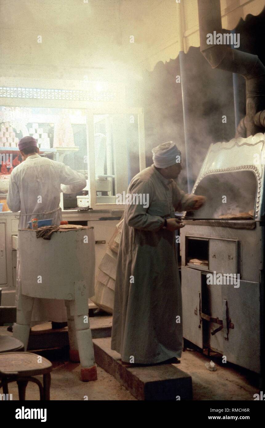 Two bakers at work Stock Photo - Alamy