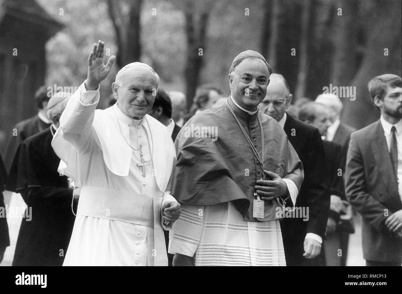 Pope John Paul II in Muenster, waving, next to Bishop Reinhard Lettmann ...