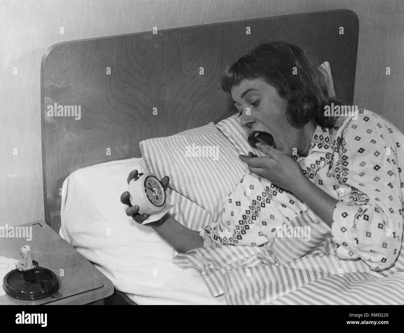 The alarm clock rings early, 50s Stock Photo - Alamy