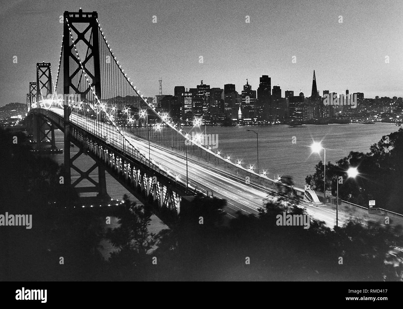 The Oakland Bay Bridge and the San Francisco skyline at night Stock ...