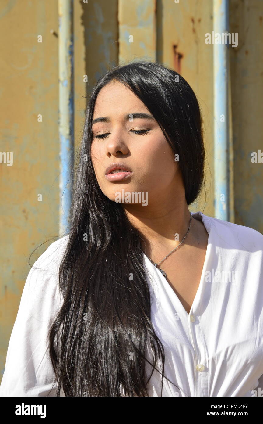 Fashion female model in street style, closed eyes Stock Photo - Alamy