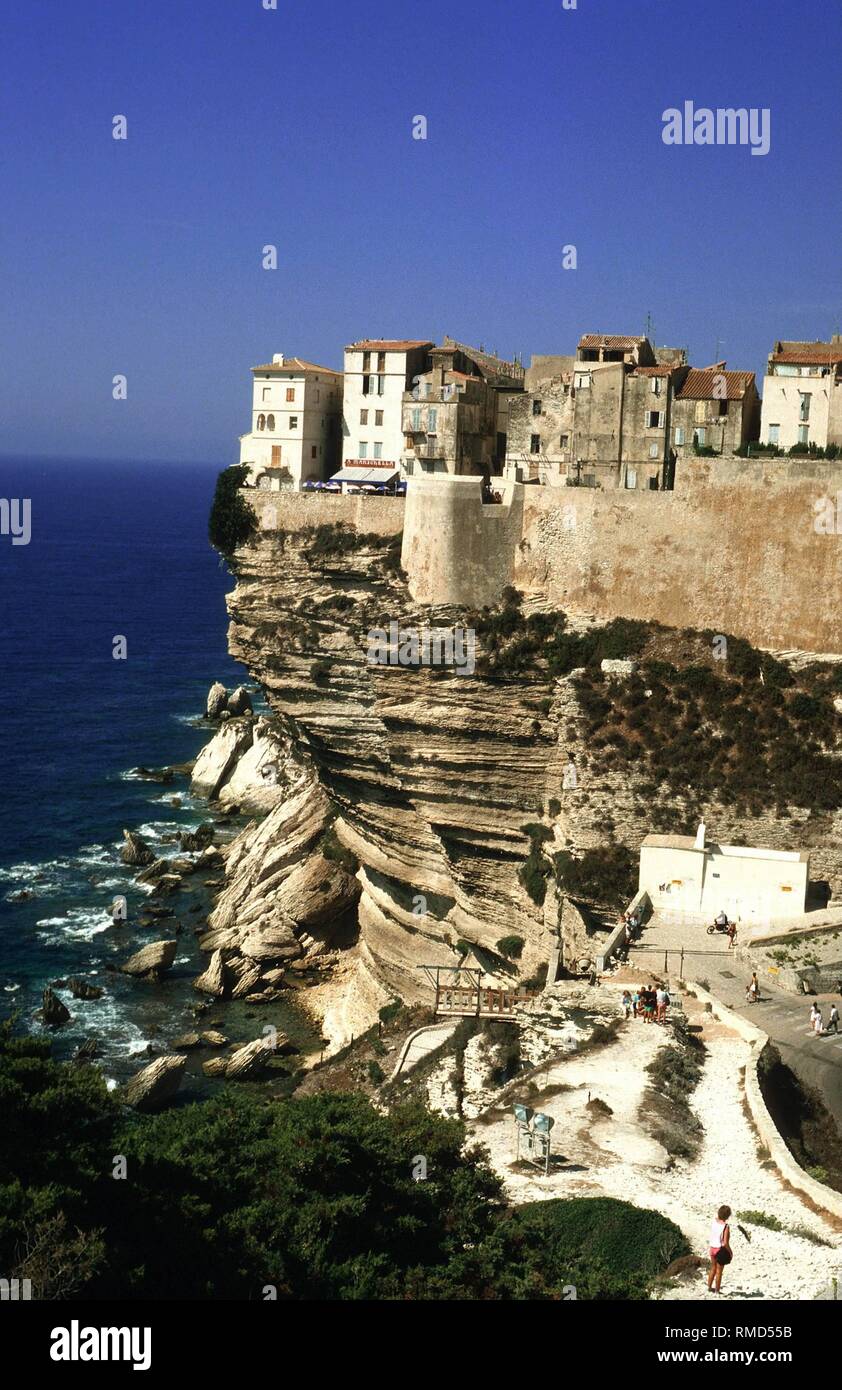 The houses of Bonifacio lie above the steep rocks where the waves break ...